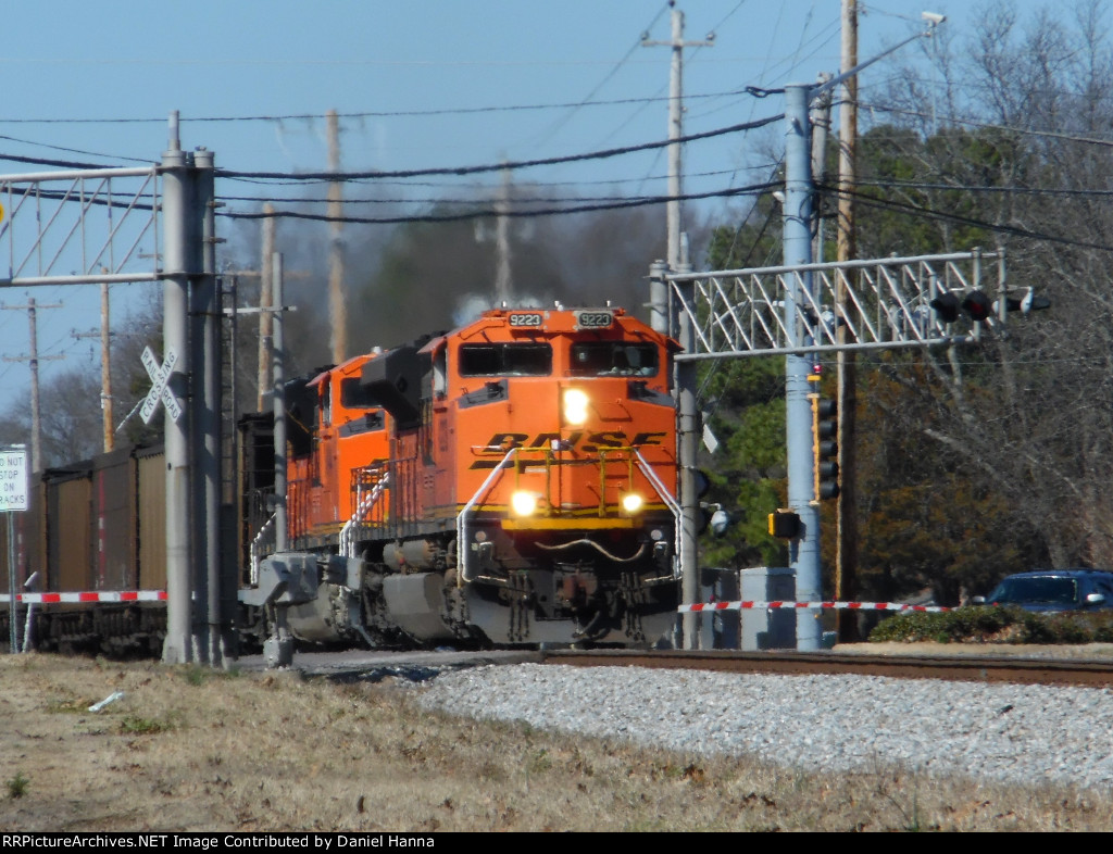 Two BNSF EMD SD70ACe's lead a loaded coal train by MP 536